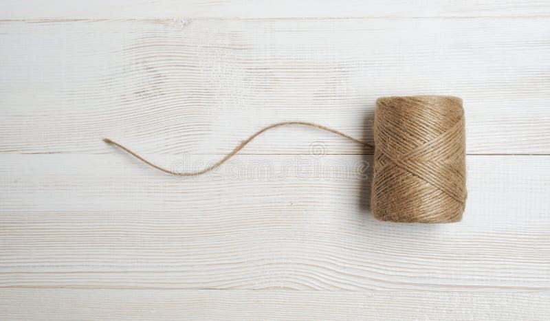 Spool of Wool Thread on a White Wooden Background. Top View Desktop ...