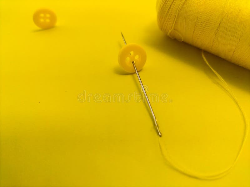 Yellow Sewing Thread Spool Needle Buttons Placed Surface Stock Photos ...