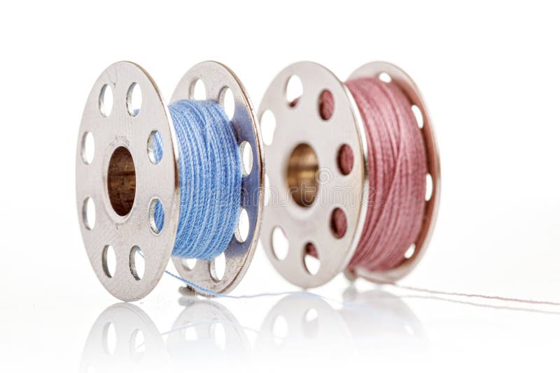 Spools of Blue and Pink Thread on a White Background Stock Image ...