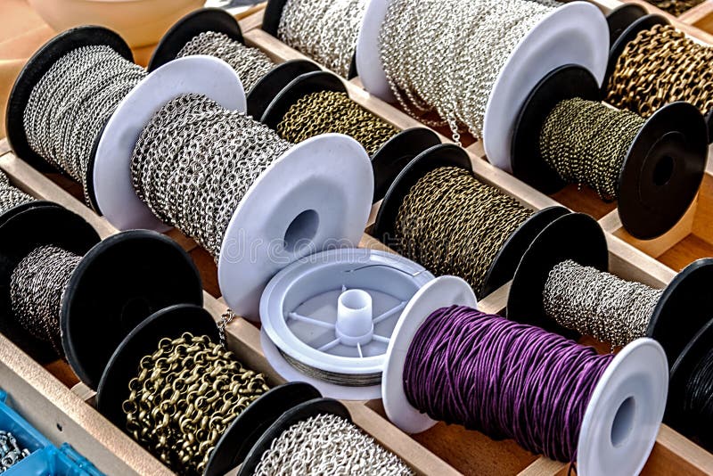 Spools with chains 1 stock image. Image of fabric, silver - 30548529