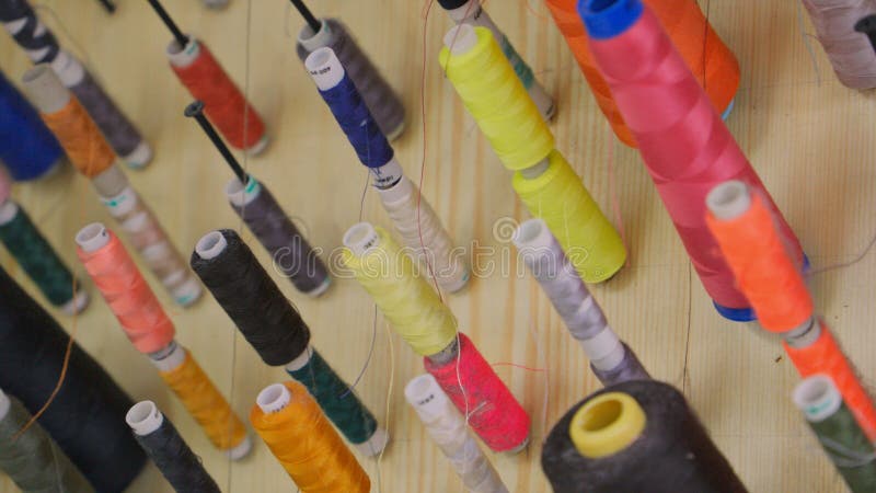 Spools of Multi-colored Threads in Sewing Workshop Stock Photo - Image ...