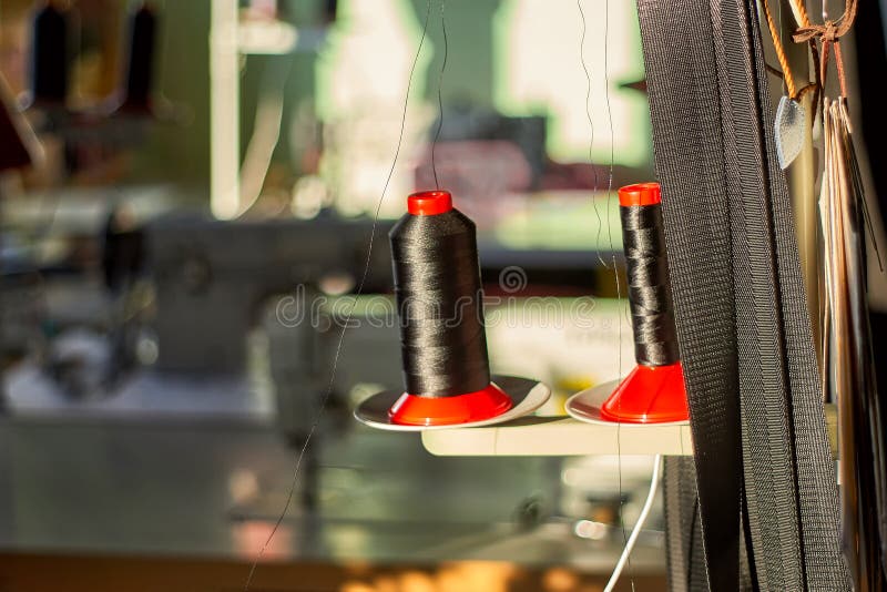 Spools of Sewing Threads. Black Threads in the Sewing Workroom Stock ...