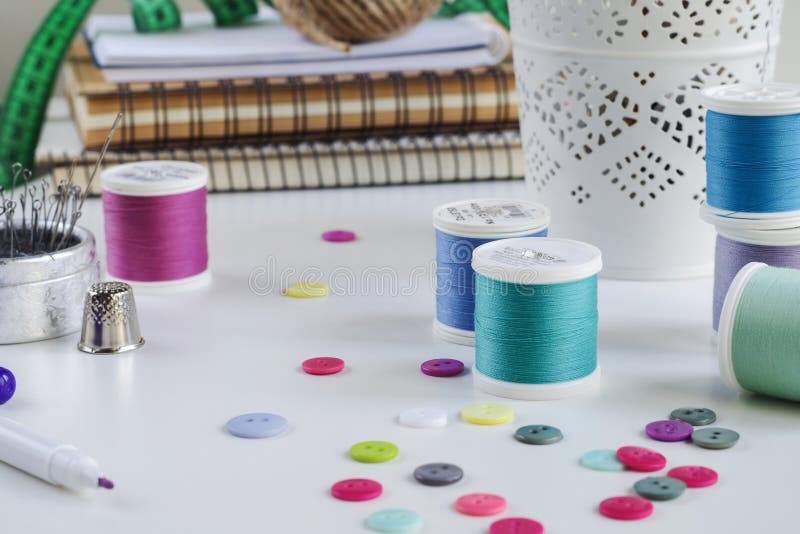 Spools of Thread and Basic Sewing Tools Including Pins, Needle, a ...