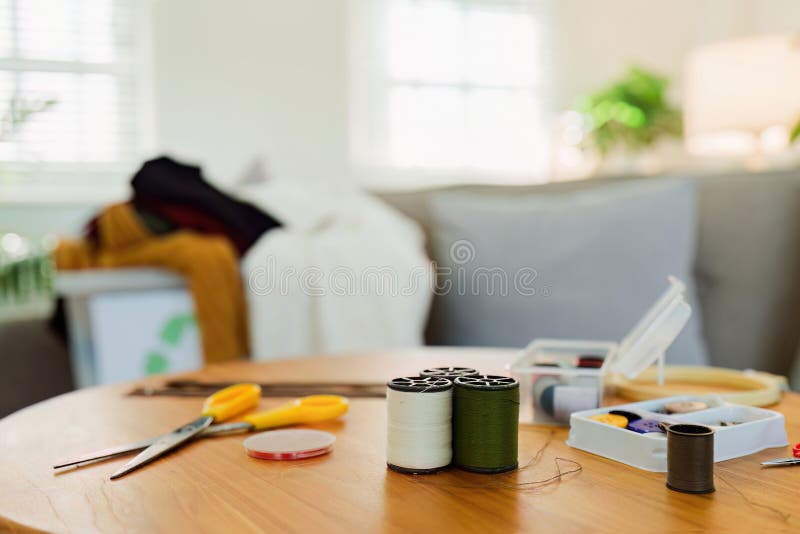 Spools of Thread and Basic Sewing Tools Including Pins, Needle, a ...