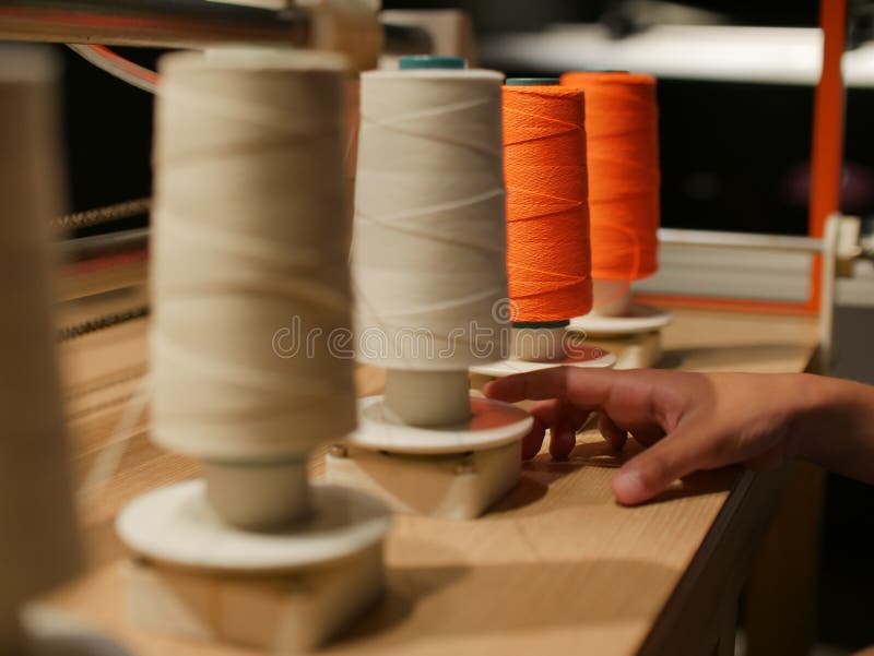 Spools of Thread Display on Wood Table in Factory Stock Image - Image ...
