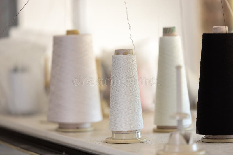 Spools of Thread in the Sewing Equipment in Fabric Industry. Sewing ...
