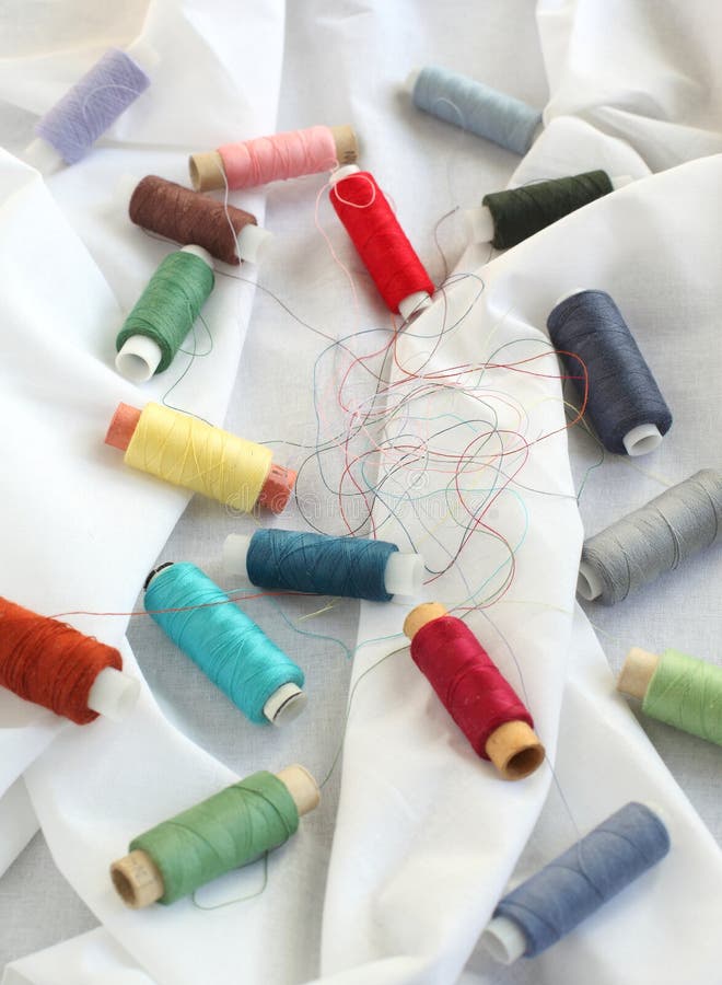 Spools of Threads on a Cotton Fabric Stock Image - Image of industry ...
