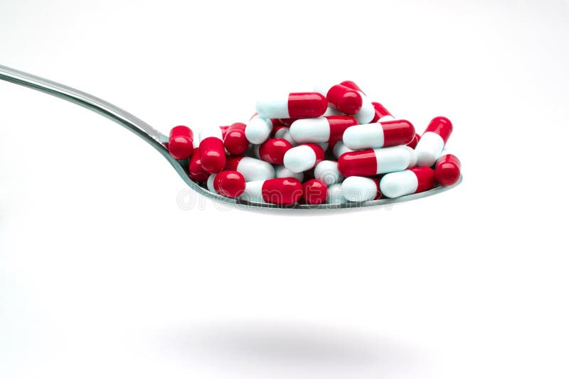 Spoon with capsules stock photo. Image of pain, health - 36019138