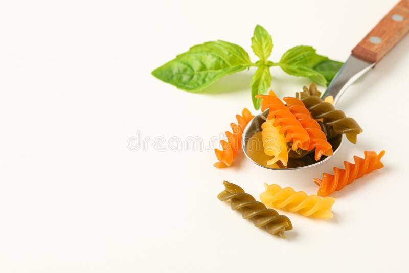 Spoon with Color Pasta on White Background Stock Photo - Image of ...