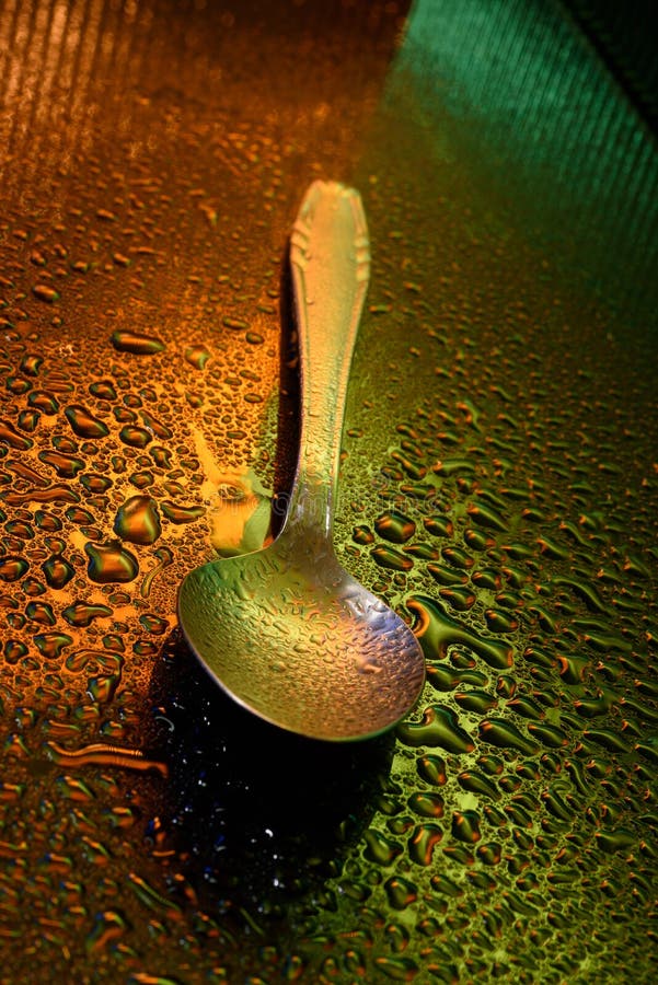 Spoon in color reflection. stock image. Image of light - 217548675
