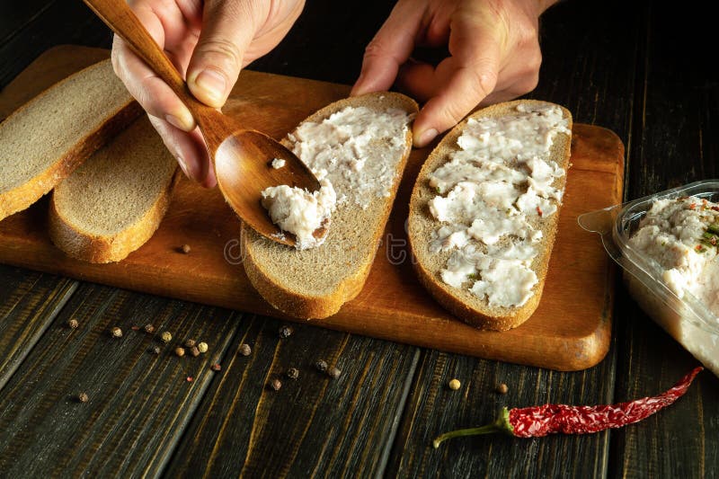 Spoon in Cook Hand with Grated Lard for Making Sandwich. Concept of ...