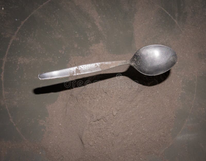 Spoon Falling Over Cocoa Powder Stock Image - Image of shadow, spoon ...