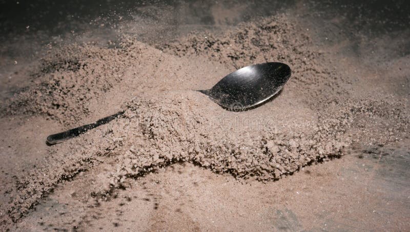 Spoon Falling Over Cocoa Powder Stock Photo - Image of grains, falling ...