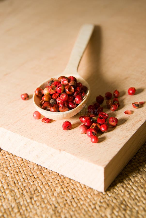 Spoon Filled with of Grains of Pepper on a Wooden Surface Stock Image ...