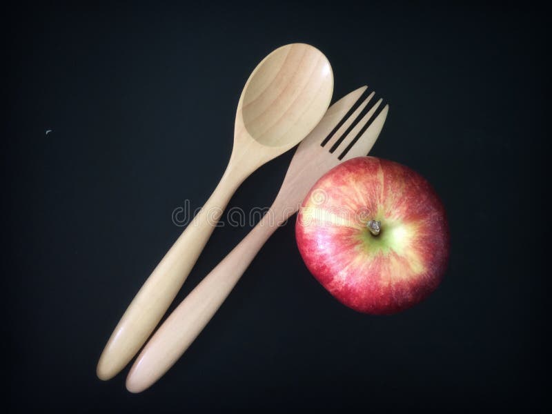 Apple Between Fork And Spoon Stock Photo - Image of eating, ripe: 33689220