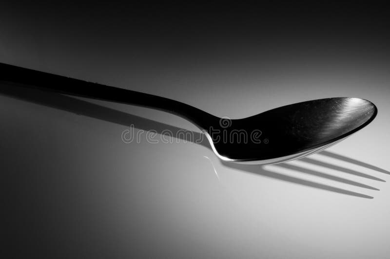 Spoon with a fork shadow stock image. Image of utensil - 42654511