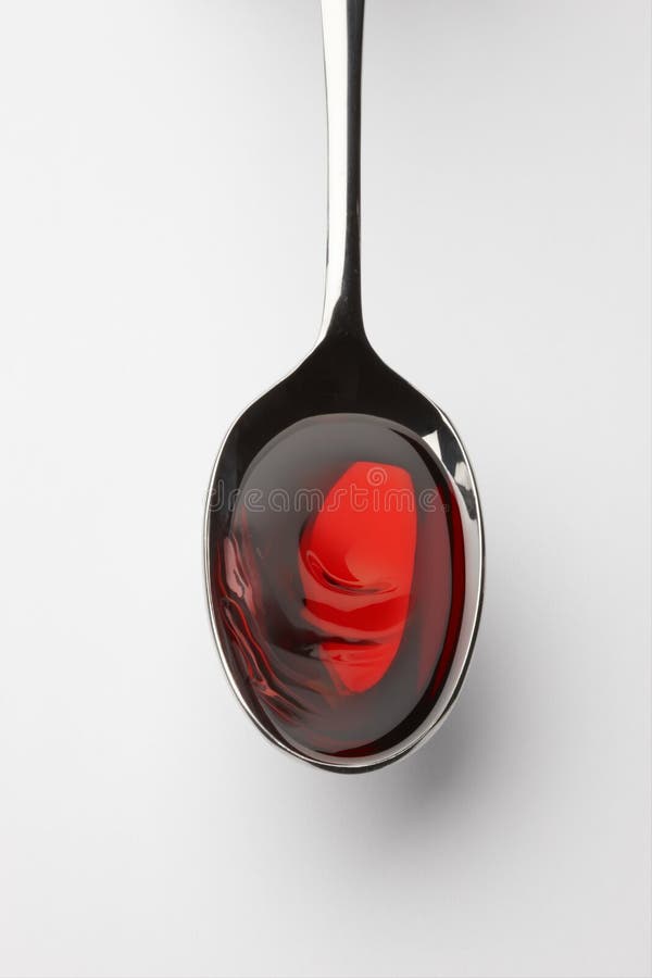 Spoon full of cough syrup stock photo. Image of medical - 12309824