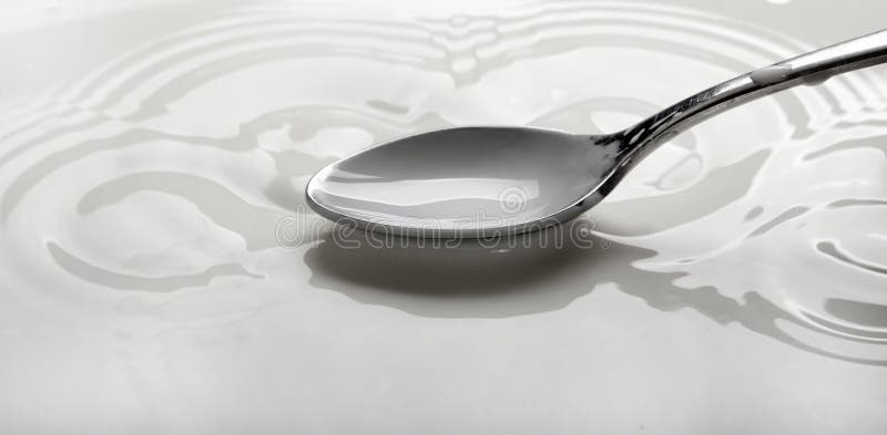 Spoon full of milk stock image. Image of flowing, health - 14732975
