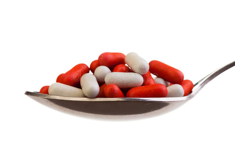Spoon full of pills stock photo. Image of medical, green - 31796014