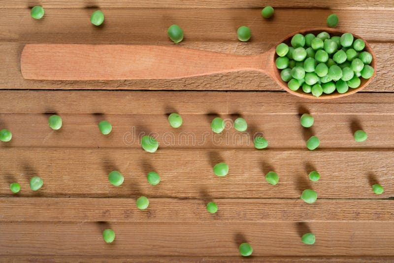 Spoon with green peas stock photo. Image of wooden, wood - 32948614