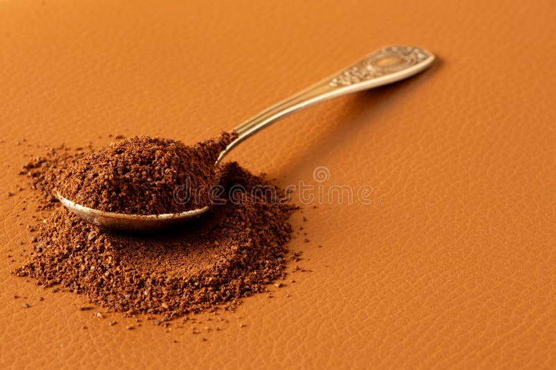 Spoon with Ground Coffee Beans on Brown Leather Background, Morning ...