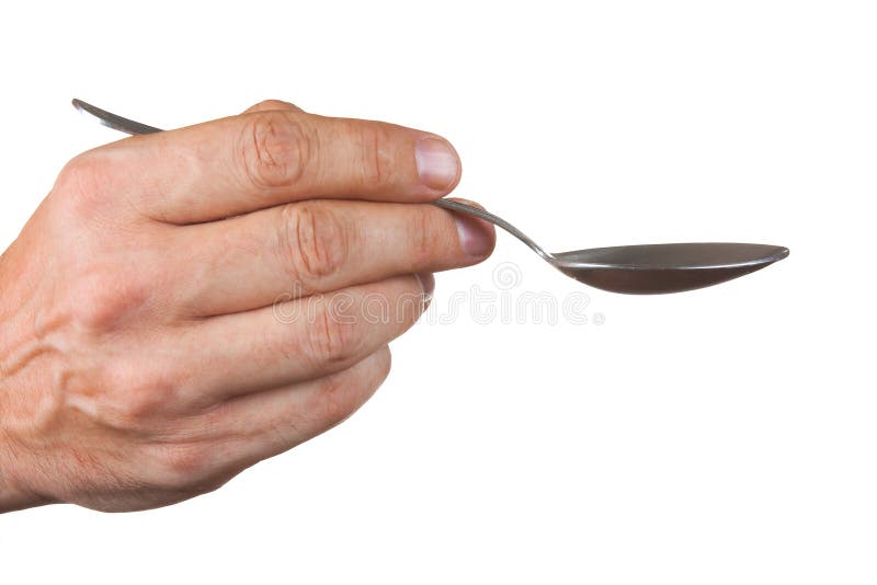 Spoon in hand stock photo. Image of isolated, background - 15649254