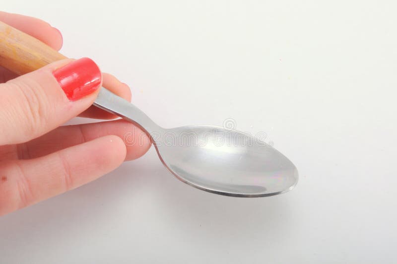 Spoon on hand stock photo. Image of holding, grip, hold - 19865300