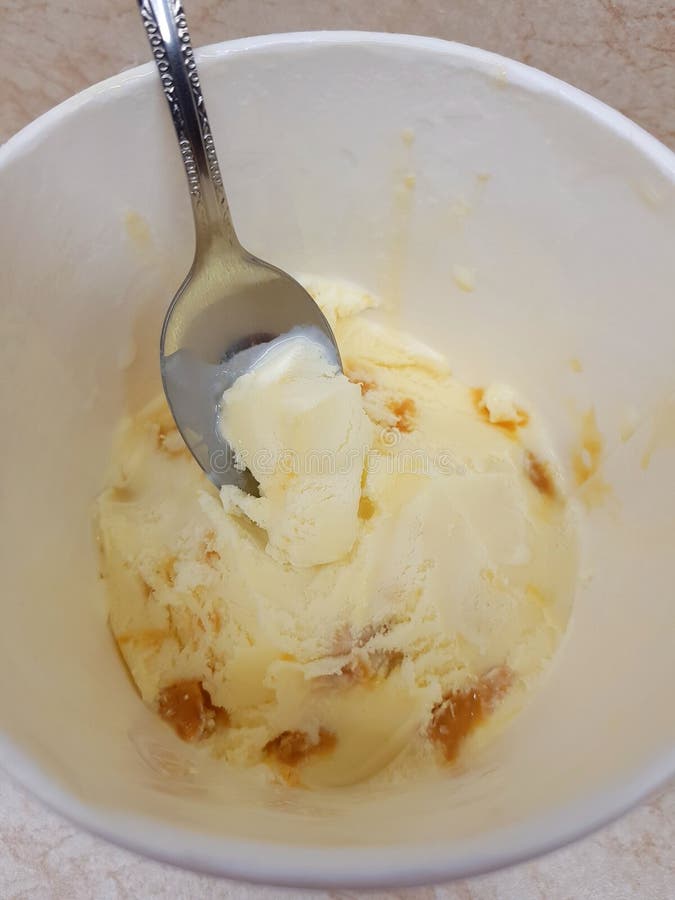 Spoon in ice cream stock photo. Image of hand, delicious - 136075920