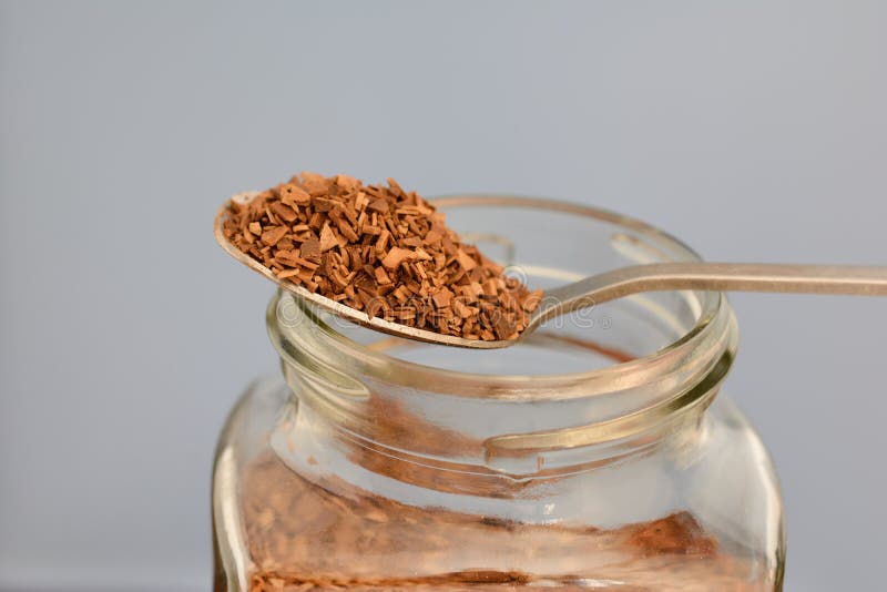 Spoon with Instant Granulated Coffee and Bank Filled with Coffee Stock ...