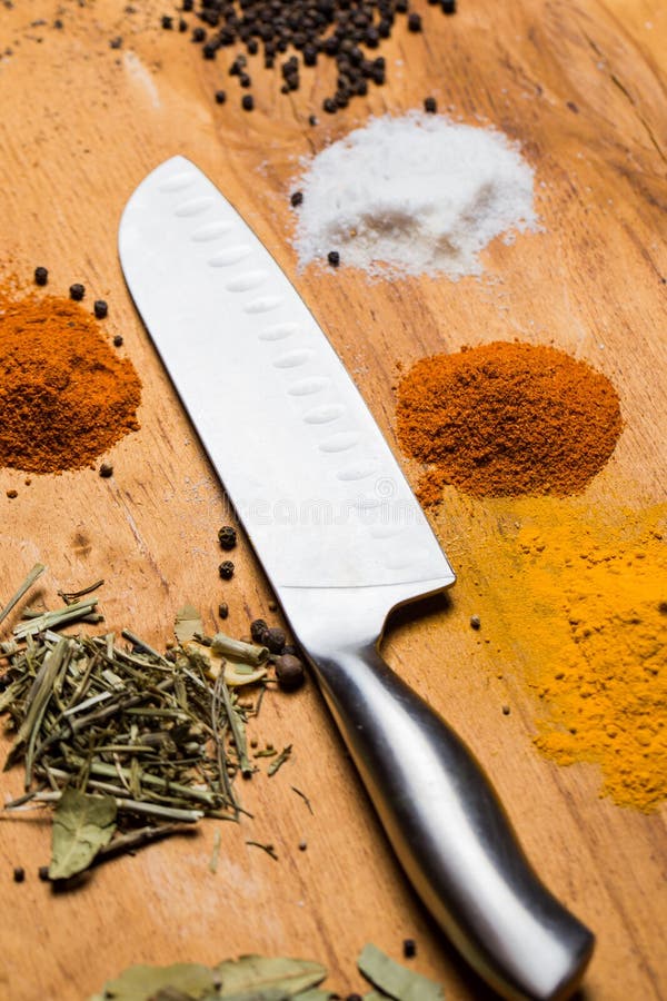 Spoon, Knife and Heap of Spices on the Table Stock Image - Image of ...