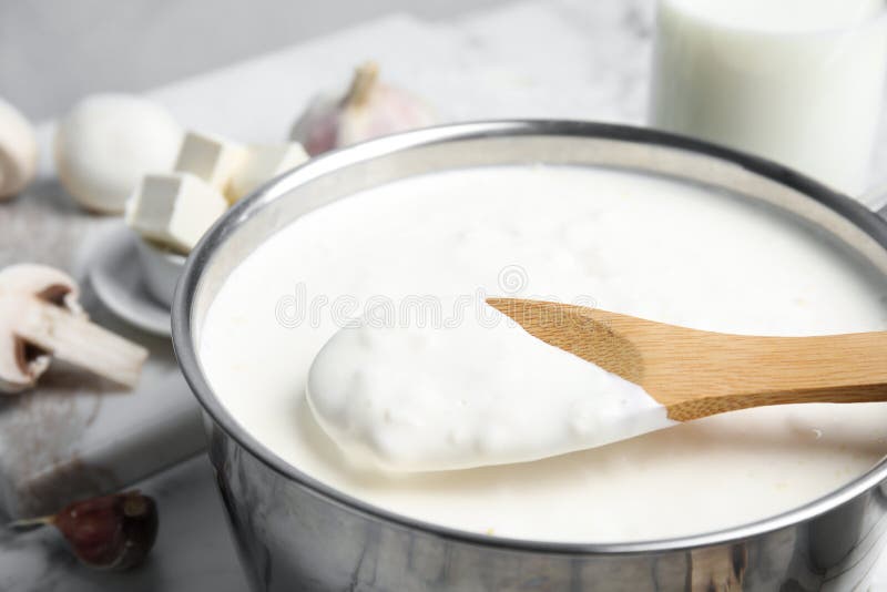 Spoon and Pan with Delicious Creamy Sauce Stock Photo - Image of diet ...