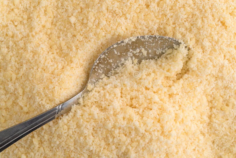 Spoon in parmesan cheese stock image. Image of yellow - 78689187