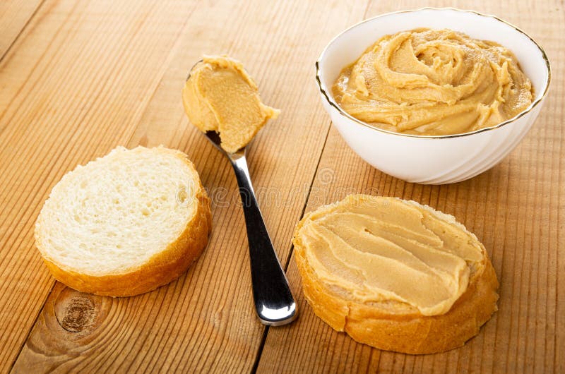 Spoon with Peanut Paste, Piece of Bread, Peanut Butter in Bowl ...