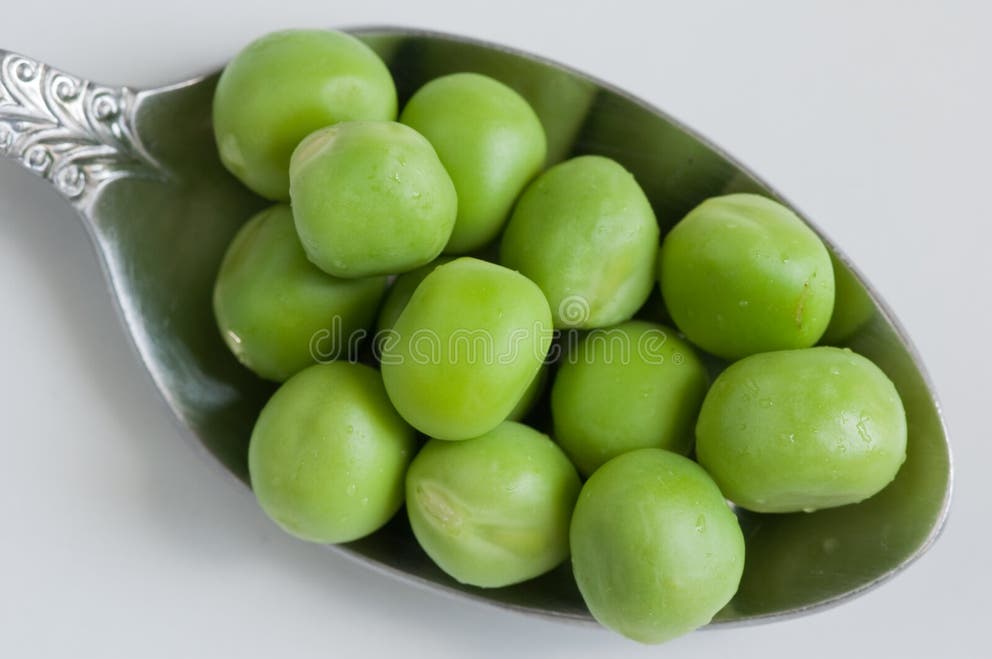 Spoon with peas stock image. Image of closeup, green - 16829705