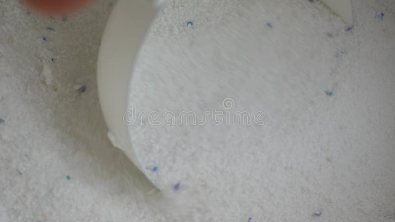 Spoon Pick Laundry Powder from a Container Stock Footage - Video of ...