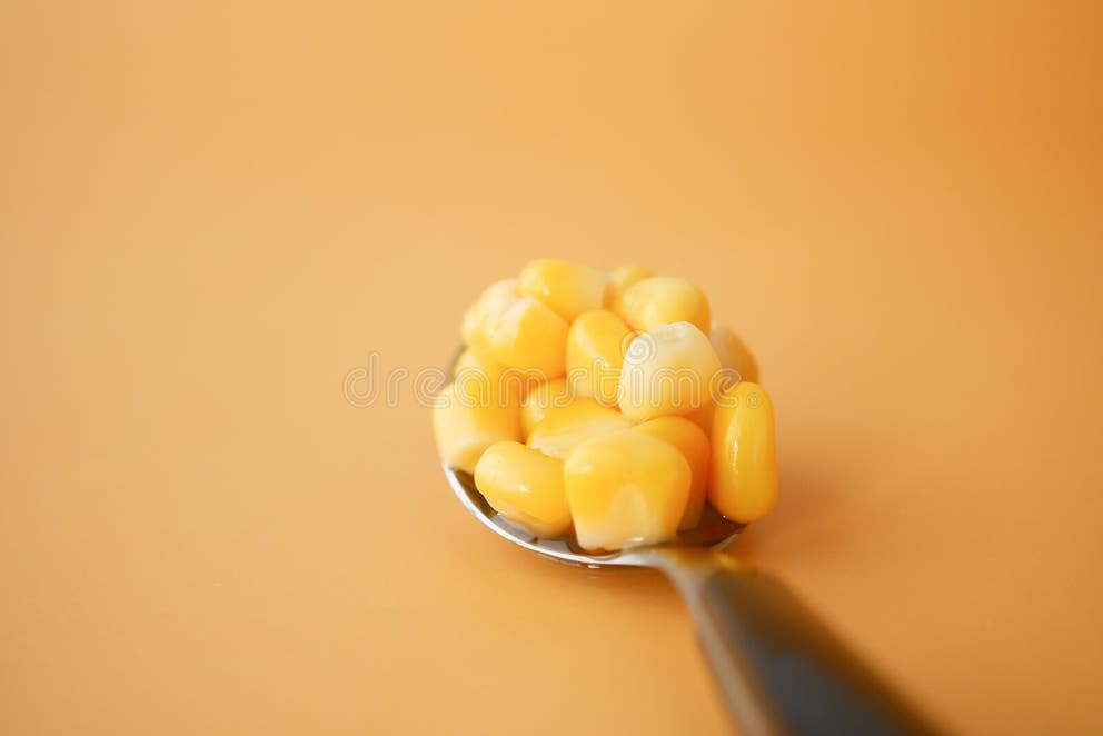 Spoon Pick Sweet Corns from a Container Stock Image - Image of boiled ...