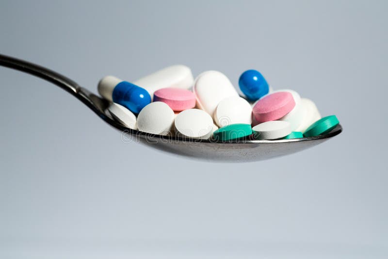 Spoon with pills close up. stock photo. Image of heap - 80486570