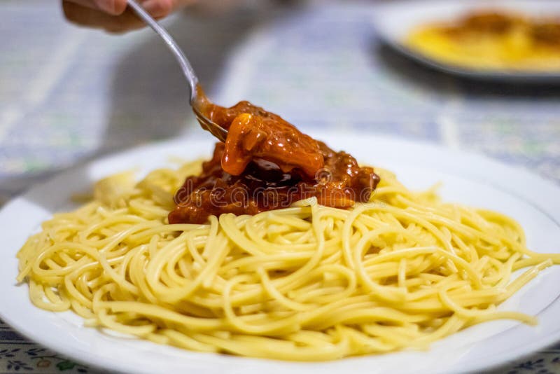 Pouring Sauce on Top of Spaghetti. Stock Photo - Image of tomato ...