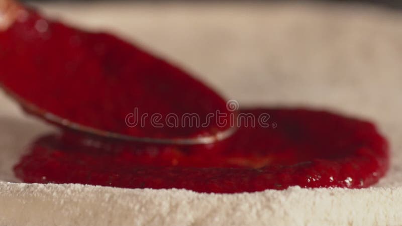 The Spoon Pours the Sauce on the Dough and Smears it in a Circular ...