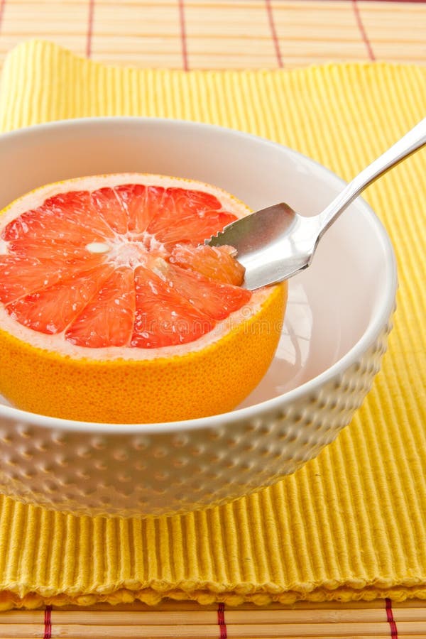 Spoon Sectioning Ruby Red Grapefruit Stock Photo - Image of taste ...