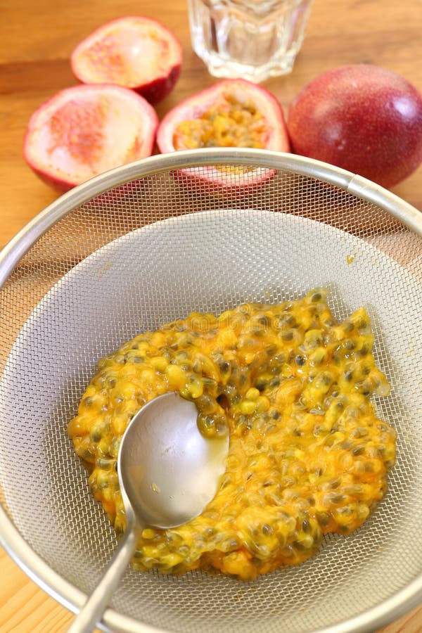 Spoon Squeezing Passion Fruit Pulps To Extract Liquid for Making Puree ...