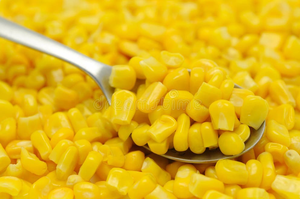 Spoon of sweetcorn kernels stock image. Image of closeup - 6215293