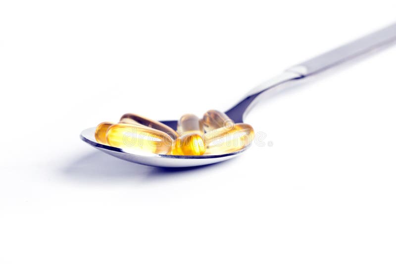 Spoon with Yellow Capsules and Pills Stock Photo - Image of healthy ...