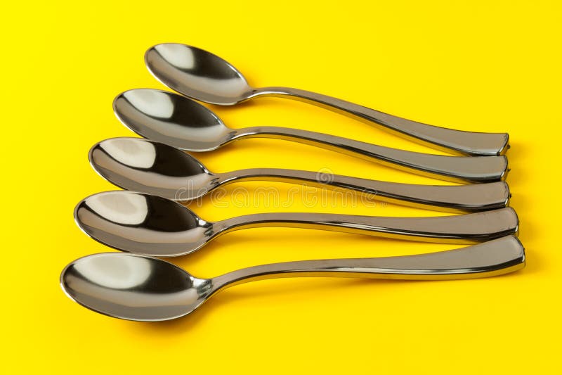 Spoon on yellow stock image. Image of kitchen, cutlery - 146178901