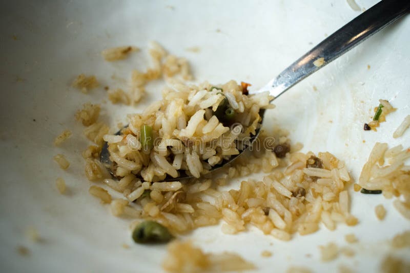 A Spoonful of Cooked Brown Rice Stock Photo - Image of cooked, isolated ...