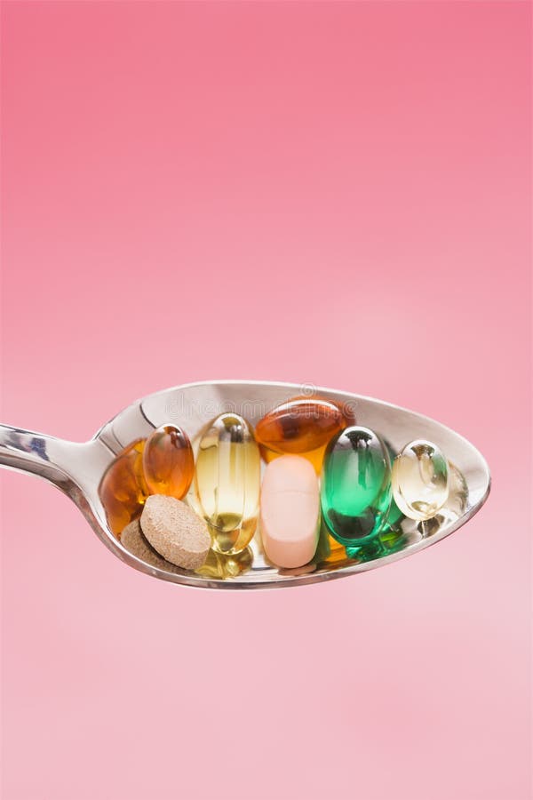 Spoon and red medicine. stock photo. Image of 070216k0005 - 2432168