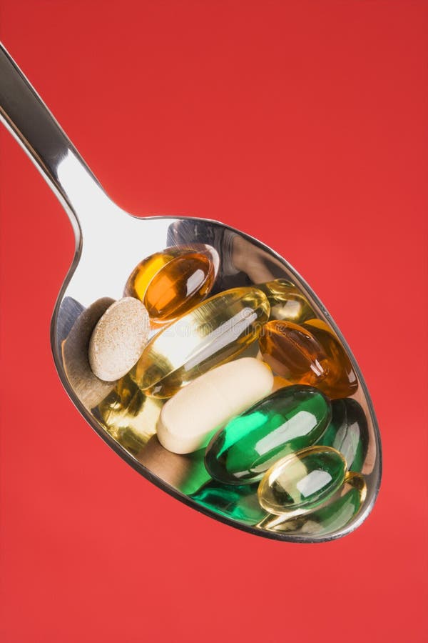 Spoonful of Pills. Isolated Stock Image - Image of dosage, copy: 12985319