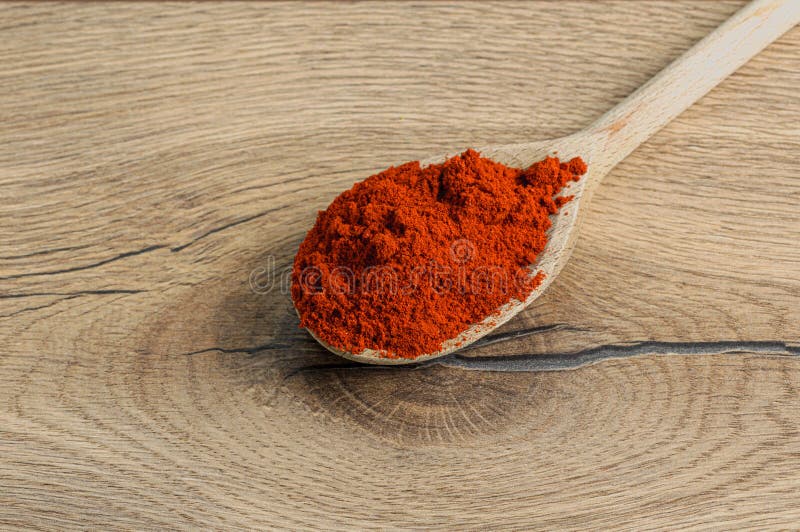 Spoonful of Red Pepper on the Wooden Surface Stock Image - Image of ...