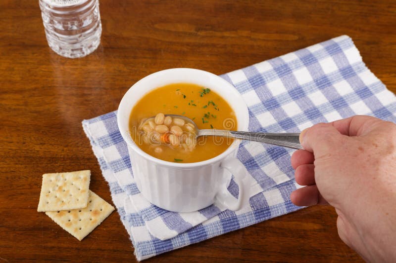 Spooning Bean Soup stock photo. Image of white, crackers - 96313218