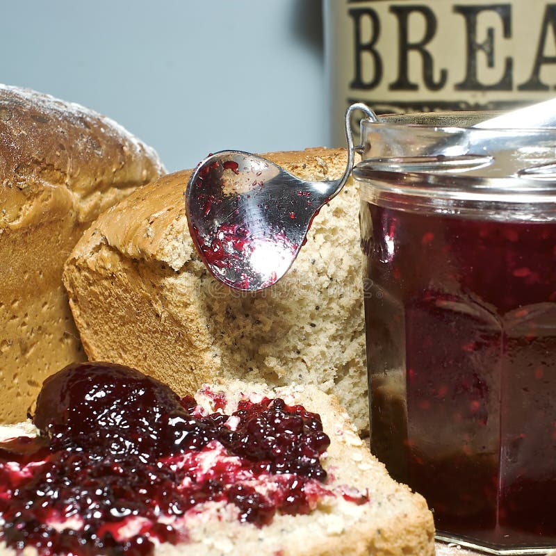 Spooning Jam Onto Hot Fresh Bread Stock Photo - Image of bakery ...